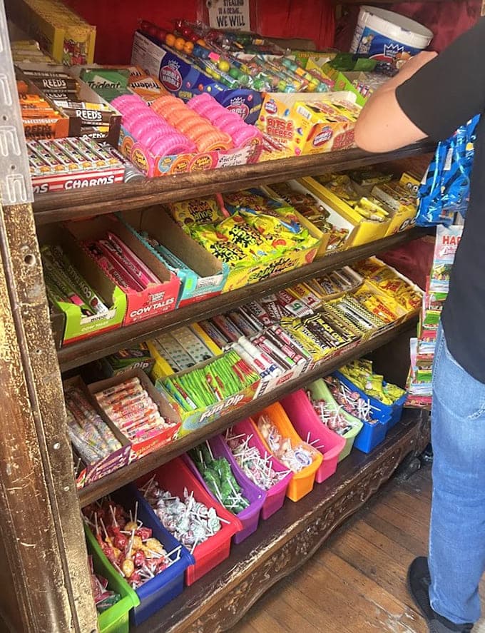 A candy display that looks like someone raided every decade's greatest hits and created the ultimate sugar-fueled time machine.