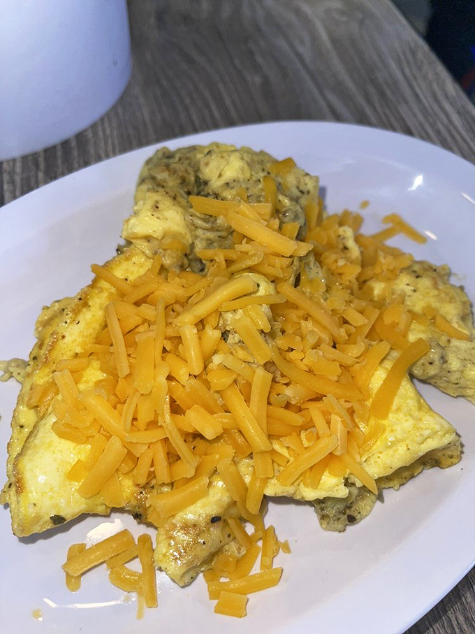 These aren't your average scrambled eggs &ndash; fluffy clouds of yellow perfection topped with melted cheddar that stretches with each heavenly forkful.