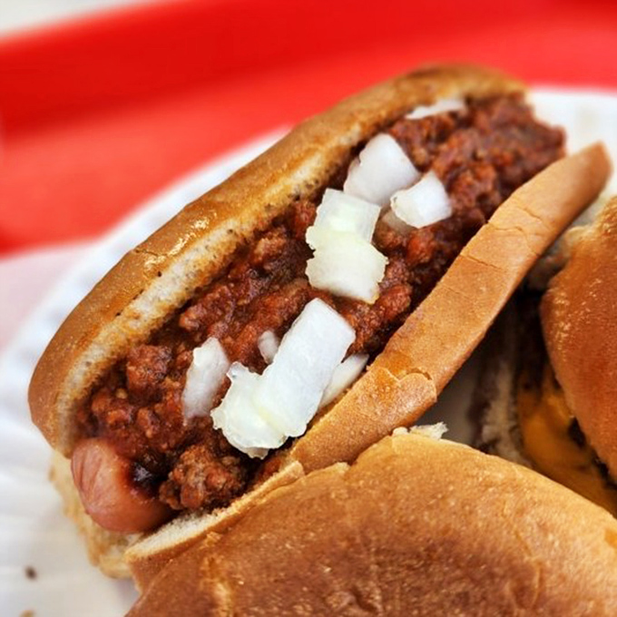The perfect chili dog: snappy frank, house-made chili, and diced onions create a symphony of flavors in every bite.