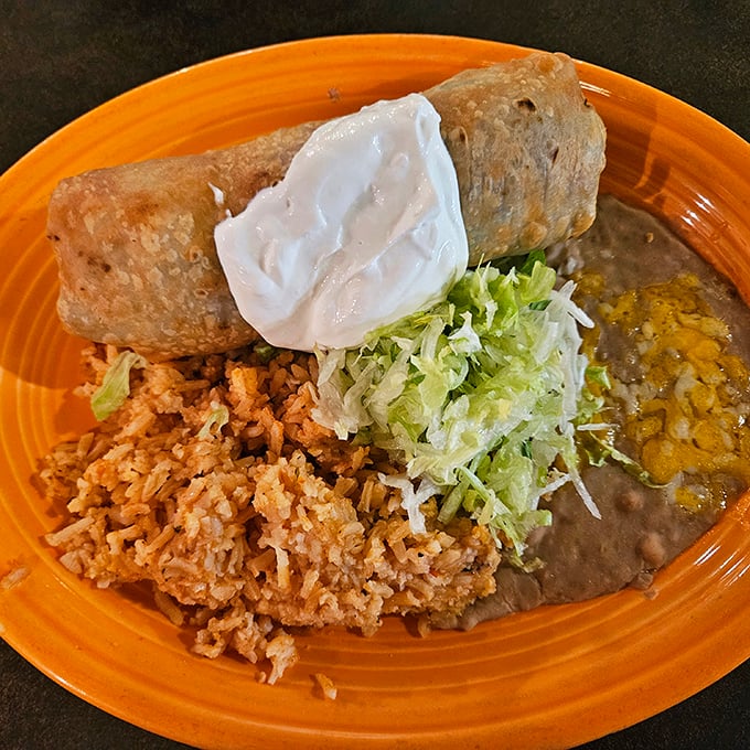 Behold the chimichanga in its natural habitat &ndash; crispy exterior giving way to a tender filling, topped with just enough lettuce to let you pretend it's healthy.