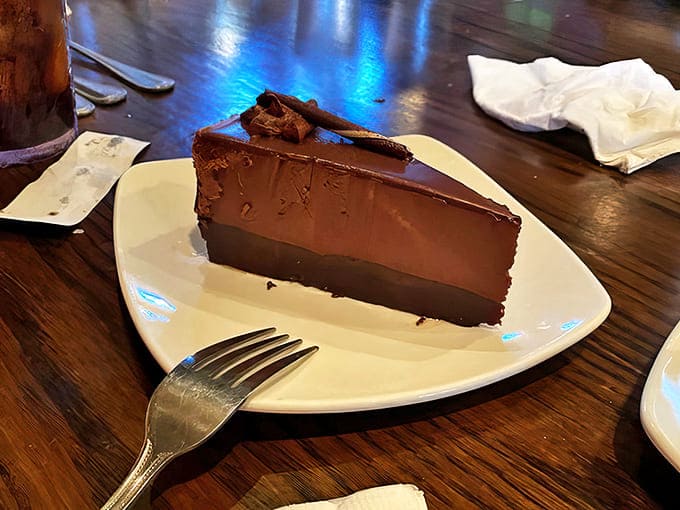 The chocolate cake stands tall and proud, layers of cocoa decadence that will have you reconsidering your "just one bite" intentions.