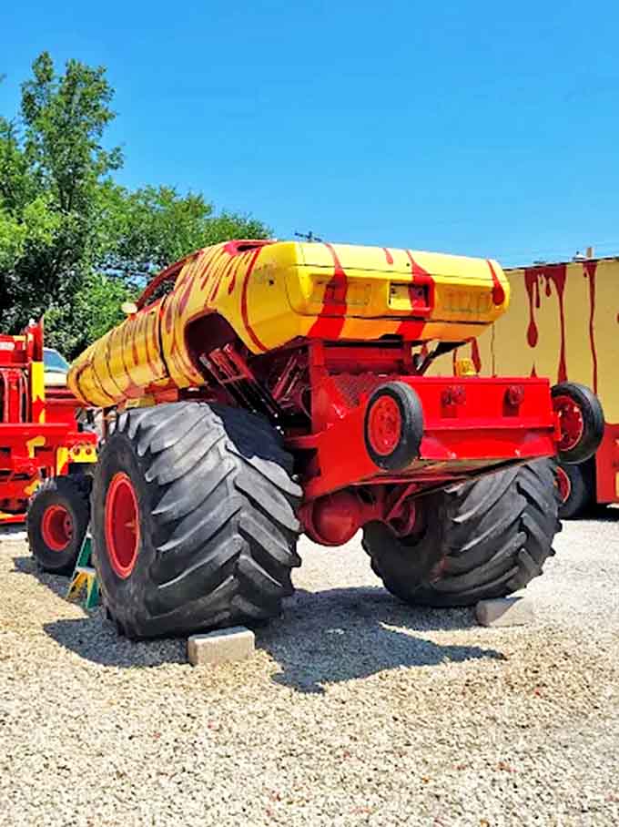 The monster truck's massive tires alone stand taller than most adults, supporting a frame that's part vehicle, part sculpture, all awesome.