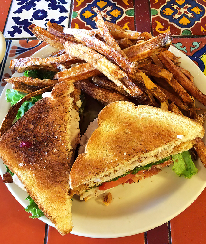 The classic club sandwich towers with fresh ingredients and comes with seasoned waffle fries that might just upstage the sandwich itself &ndash; almost.