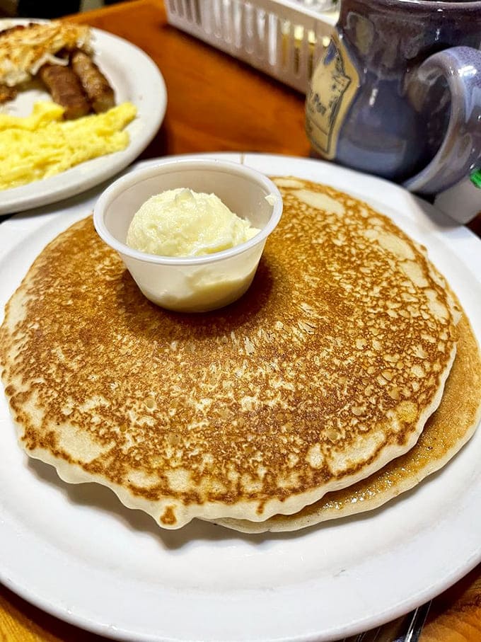 Pancakes so golden and fluffy they could double as edible clouds, with butter melting into every perfect bite.
