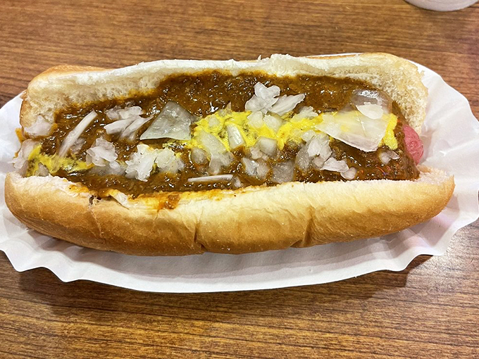 Behold, the Coney Dog in all its glory! This bad boy is dressed to impress with more toppings than a pizza convention.