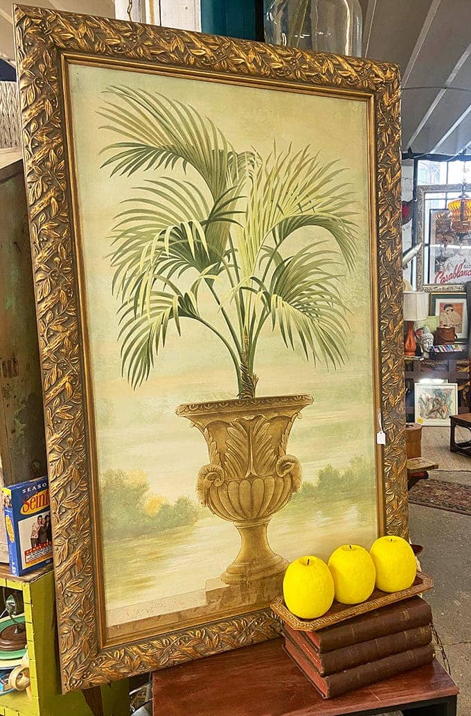 Framed picture: This elegant palm painting in its ornate gold frame proves that sometimes yesterday's decor makes the perfect statement in today's homes.