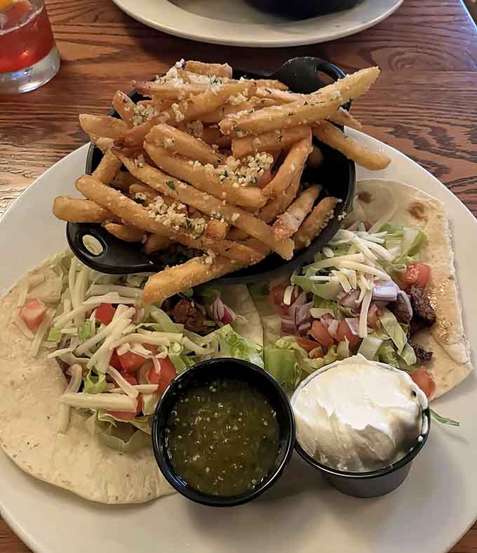 Steak tacos paired with parmesan truffle fries prove the kitchen knows its way around multiple taco styles.