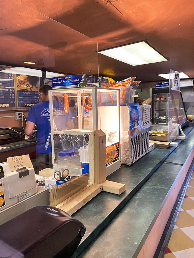 Behind this counter, concession workers hustle to serve hungry movie fans with the timeless treats that define the drive-in experience.
