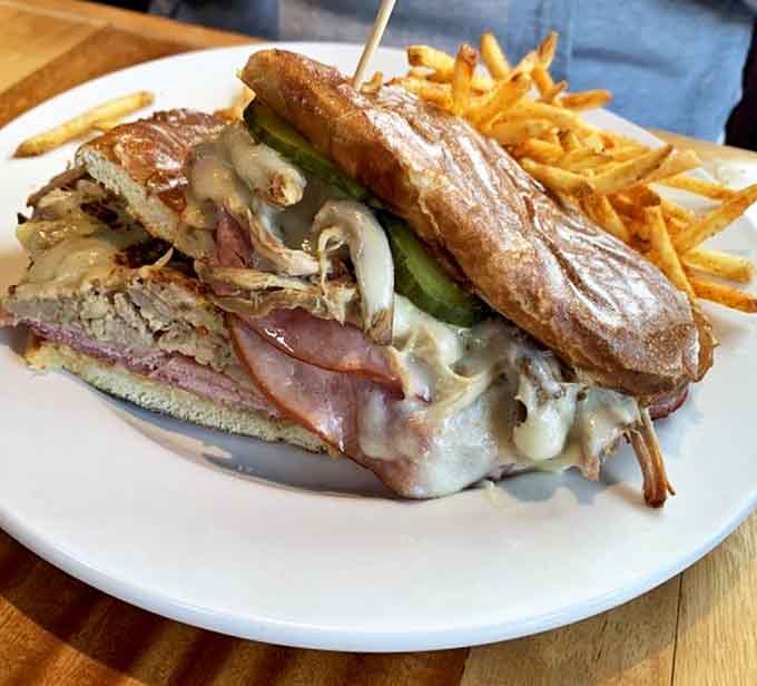 The Cuban Sandwich stacks pressed perfection between bread that's crispy outside and tender within, just as intended.