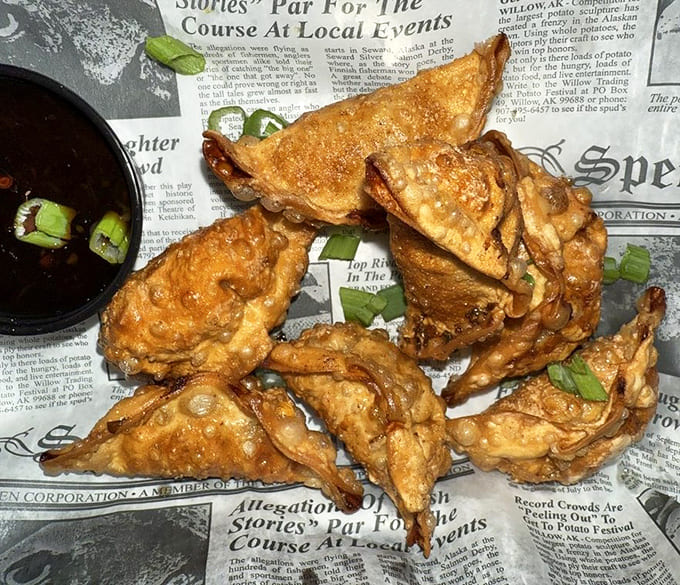 Golden chicken potstickers lined up like edible soldiers, ready to march straight into your mouth with their crispy exteriors.