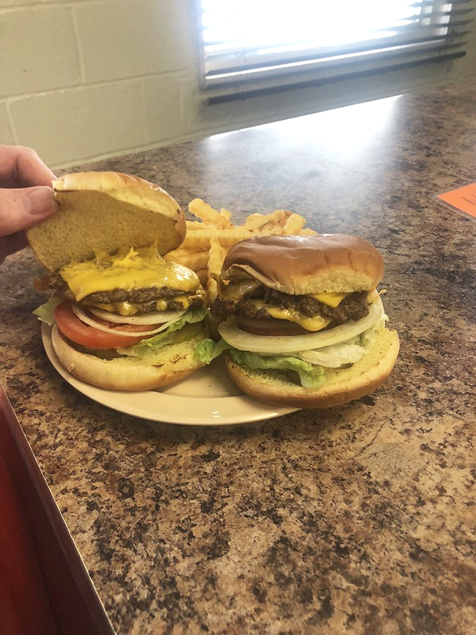 Double the patty, double the fun! This towering masterpiece is a testament to the "go big or go home" burger philosophy.