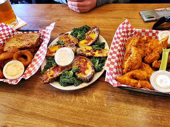 This spread showcases the variety available at Duffy's, from wings to loaded potatoes to perfectly cooked proteins that satisfy every appetite.