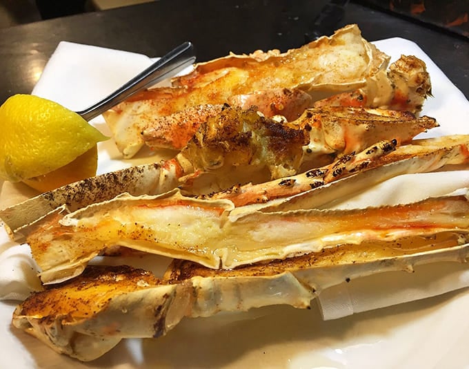 Split king crab legs broiled to buttery perfection require rolled-up sleeves and complete commitment to the delicious task at hand.