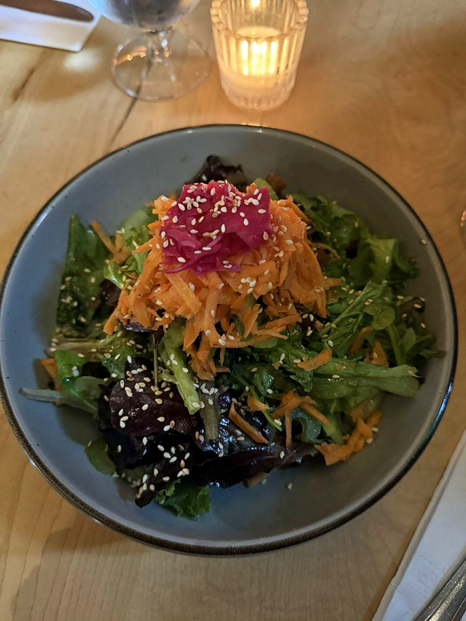 A salad that actually excites! Vibrant greens, shredded carrots, and those sesame seeds add texture that makes your fork want to dive right in.