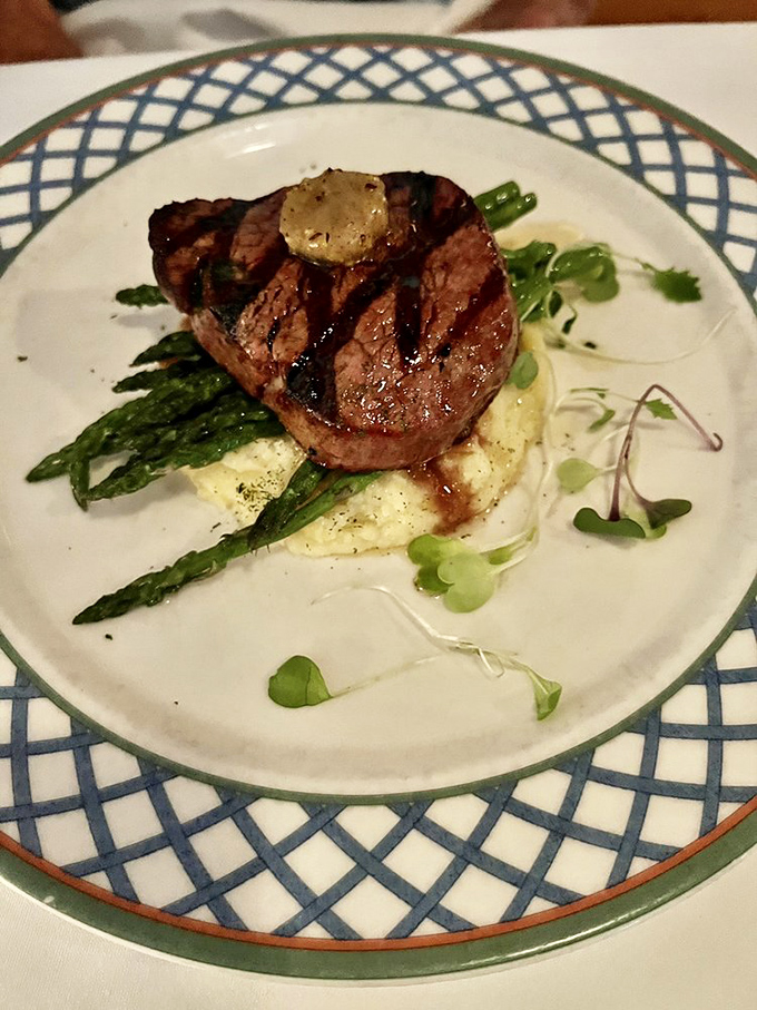 The Filet Mignon sits regally on a bed of asparagus and mashed potatoes&mdash;simple ingredients transformed through perfect execution.