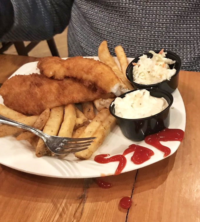 A symphony of textures &ndash; crispy fish, fluffy potatoes, and creamy coleslaw create the holy trinity of fish and chips perfection.