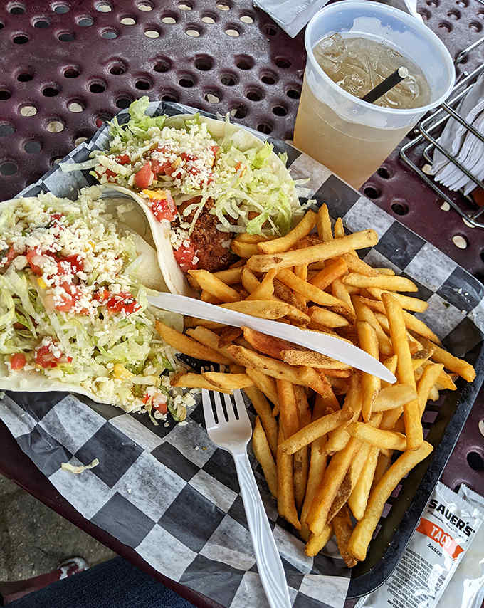 The ultimate pairing: golden fish tacos with perfectly crisp fries &ndash; simple food executed flawlessly against a backdrop of island charm.