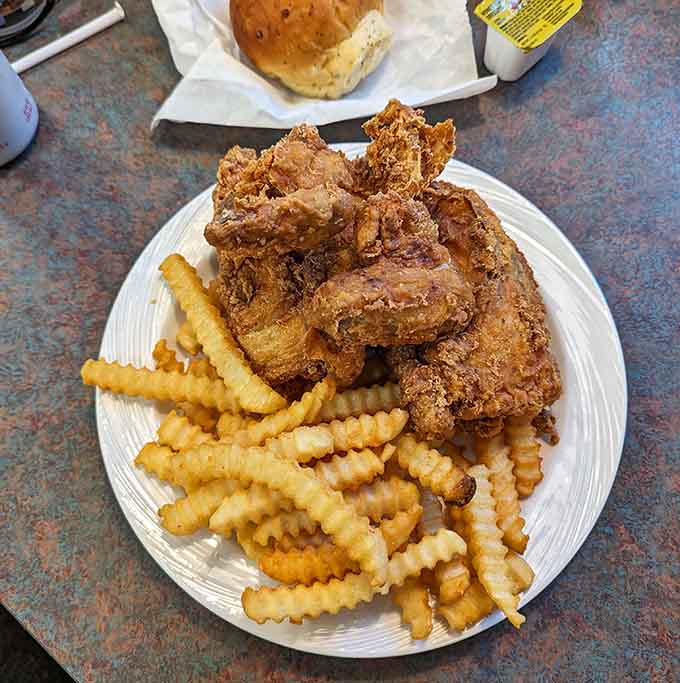Golden fried chicken with crispy fries proves this kitchen knows its way around more than beef.