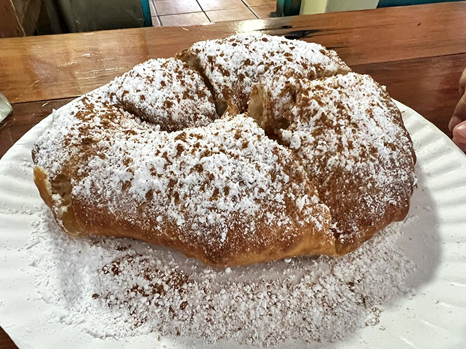 Dessert perfection: golden fry bread dusted with powdered sugar and cinnamon &ndash; proof that the simplest pleasures are often the most profound.