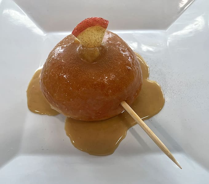 A caramel apple donut that captures fall in a single, sticky, wonderful bite, complete with toothpick.
