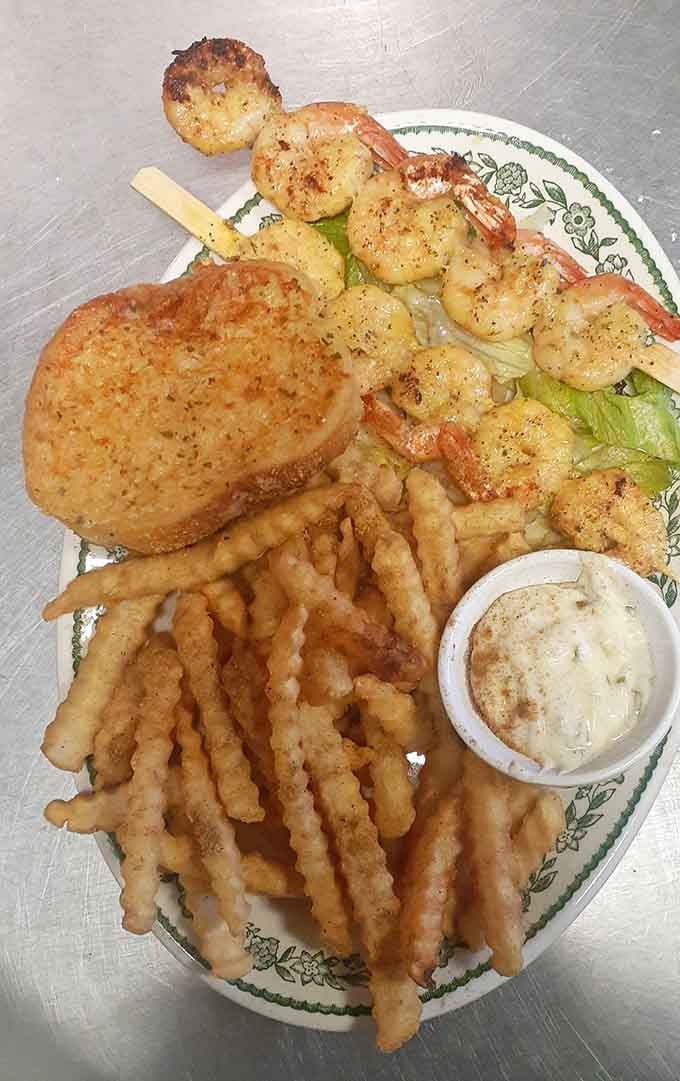 Grilled shrimp on a skewer brings surf to this turf-heavy menu with style and citrus.