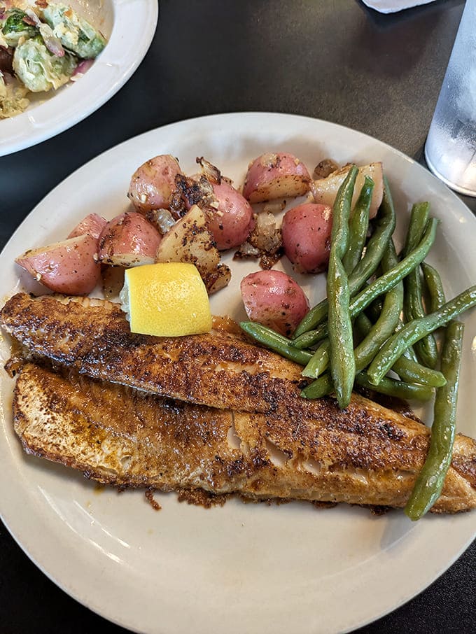 Perfectly seasoned fish with roasted potatoes and green beans &ndash; healthy eating that doesn't sacrifice an ounce of flavor or satisfaction.