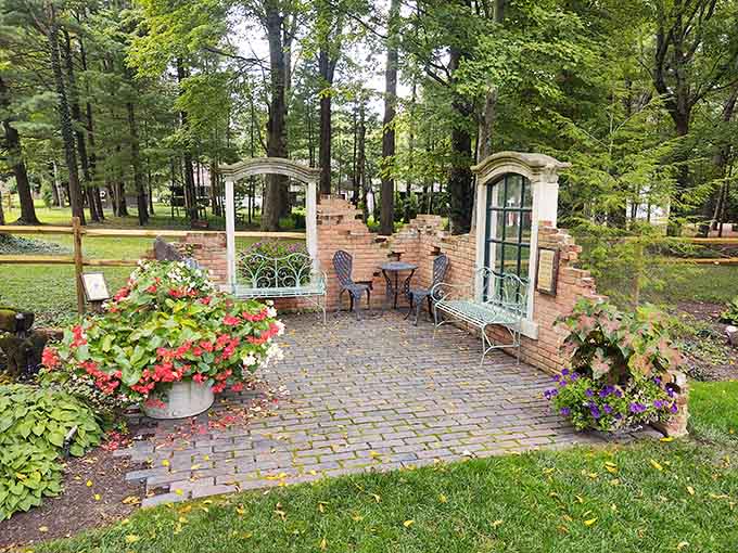 This brick patio seating area with its arched doorways and vintage touches feels like an outdoor living room where even the furniture looks happy to be there.