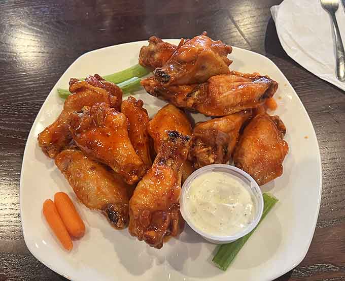 Wings glazed to perfection, the kind that make you forget about using napkins until it's way too late.