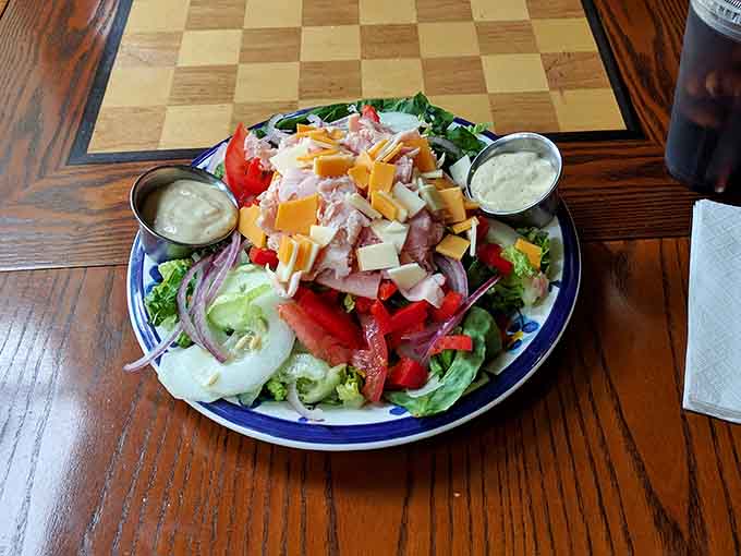 This Greek salad doesn't mess around, loaded with fresh vegetables, eggs, and enough toppings to make it a meal.