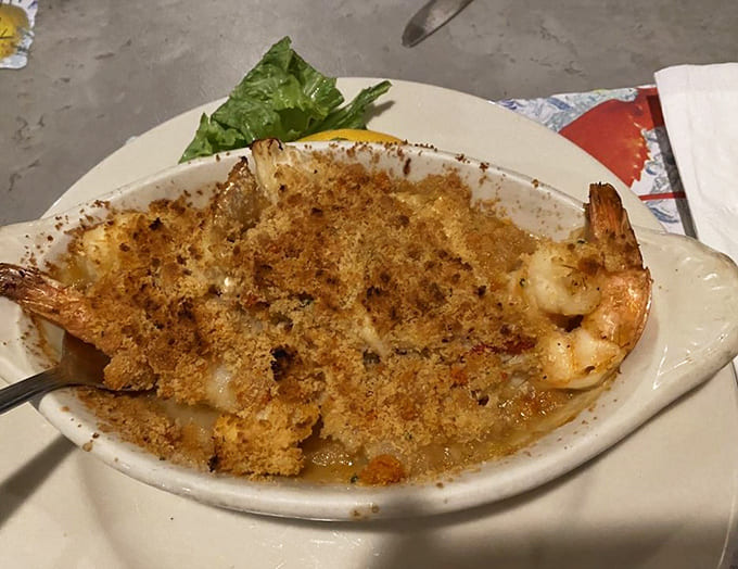 That golden-crusted casserole bubbling with seafood goodness could convert even the most devoted landlubber to coastal cuisine.