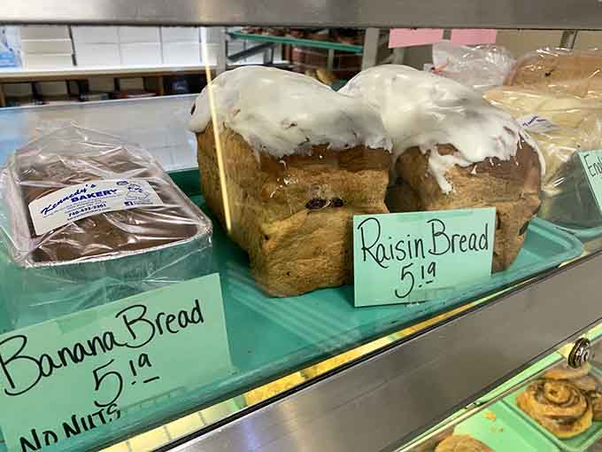 Banana bread and raisin bread sitting pretty on the shelf, both moist enough to make you forget that sad, dry grocery store stuff forever.