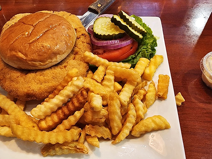 A burger that requires a game plan and crinkle-cut fries that could make a French chef question their life choices.