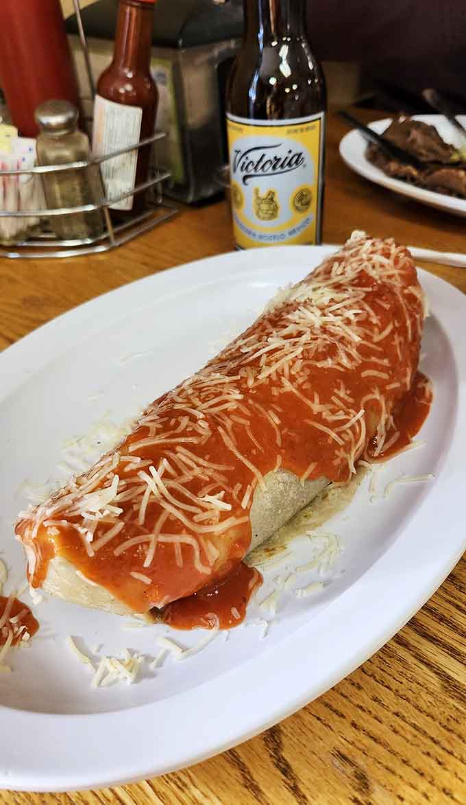 Smothered in sauce and cheese, this enchilada-style burrito proves that sometimes more really is more, especially when it tastes this good.