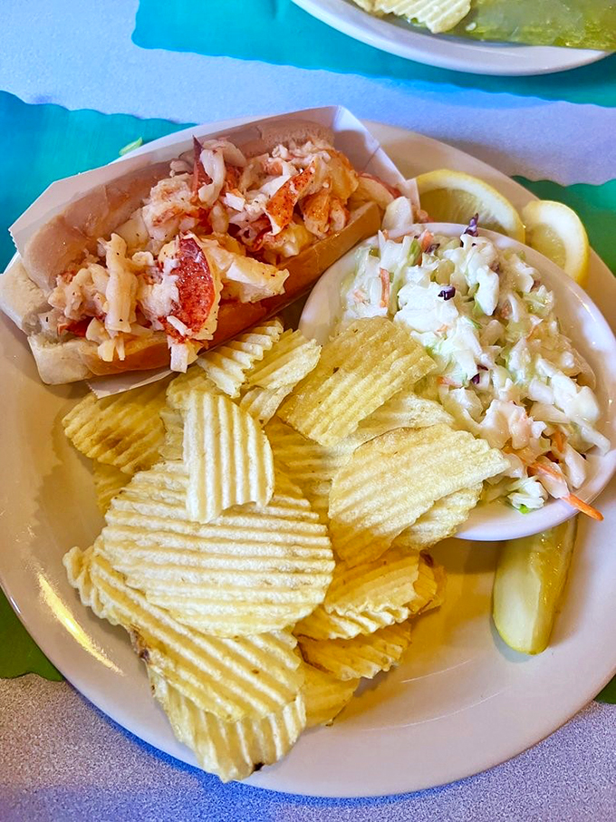 The lobster roll that launched a thousand road trips, served with chips and coleslaw for the full Maine experience.
