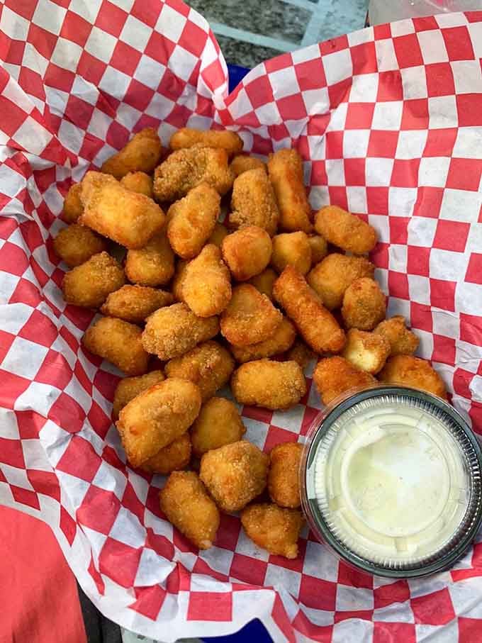 Golden cheese curds stretch and satisfy, bringing Wisconsin's finest contribution to your Minnesota meal.