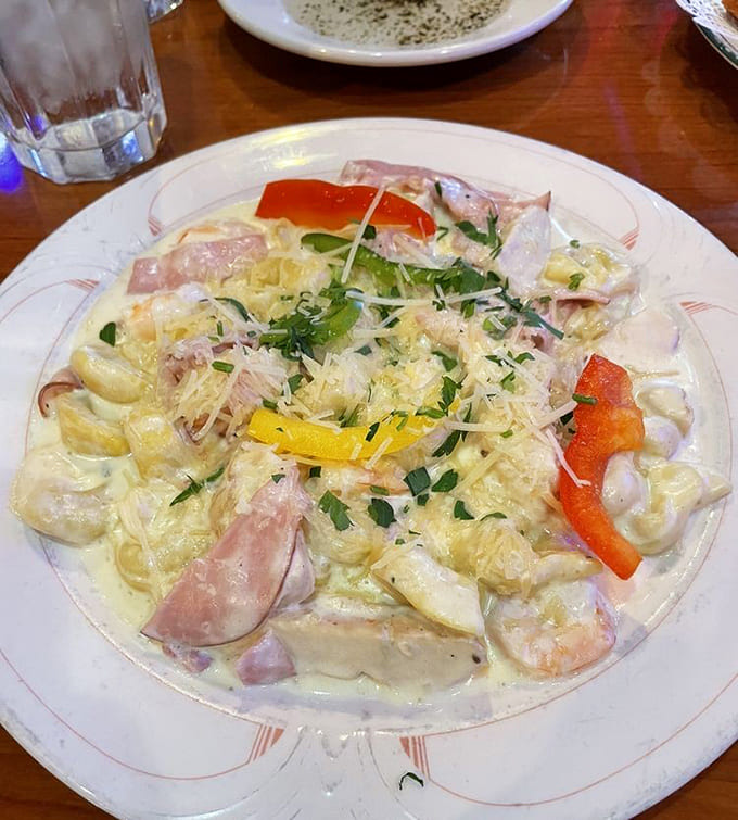 Amante Di Luna combines chicken, shrimp, and prosciutto in creamy sauce over tortellini, creating a dish that's basically a love letter to your taste buds.