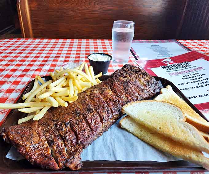 When ribs look this good on a checkered tablecloth, you know you're in for a meal that'll haunt your dreams in the best way.