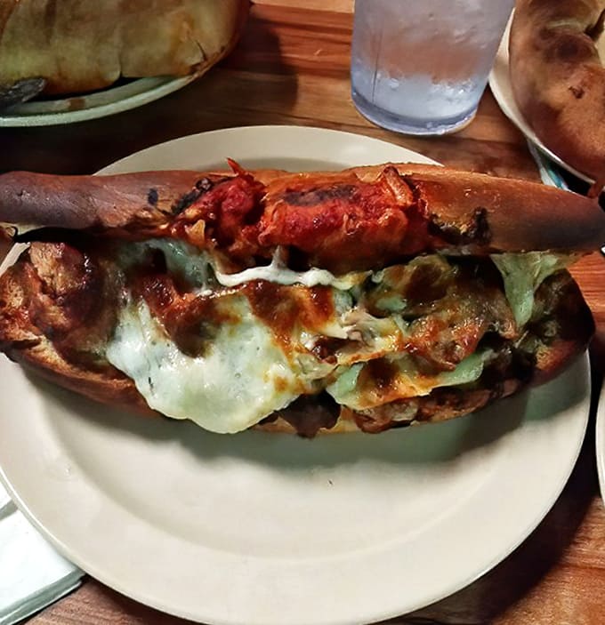 A sandwich that requires both hands and several napkins &ndash; the kind of messy masterpiece that makes you forget about table manners.