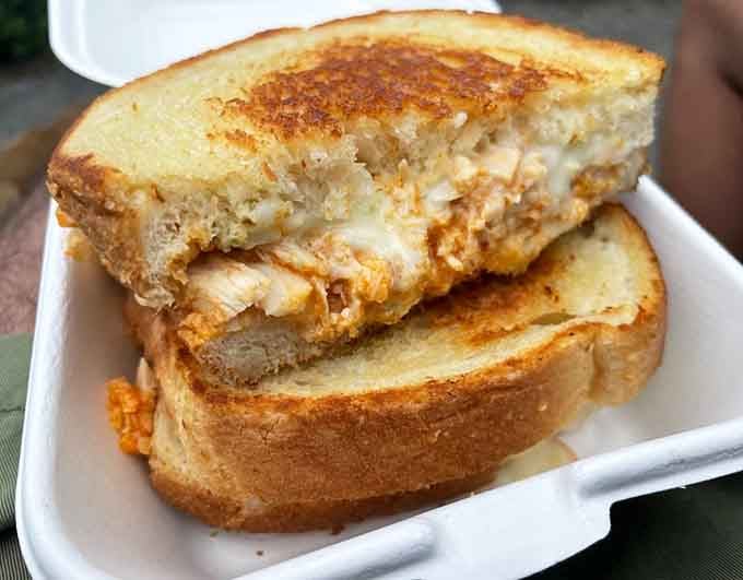 Buffalo chicken meets melted cheese in a sandwich that understands the assignment and exceeds expectations with every bite.