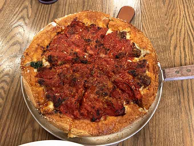 Classic Chicago deep-dish in all its glory, with that signature thick crust cradling layers of cheese and toppings.