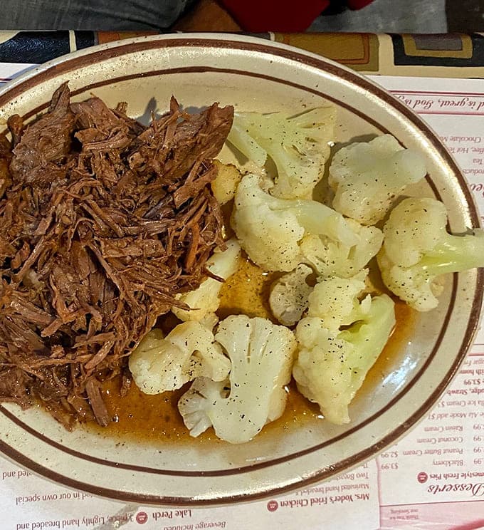 Even cauliflower looks appetizing next to that tender pot roast, proving miracles do happen in Ohio kitchens.