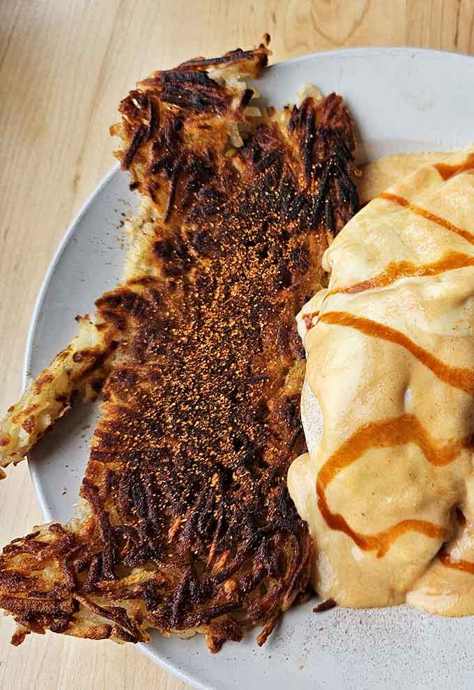 Those hashbrowns achieve that elusive crispy-on-the-outside, fluffy-on-the-inside perfection that makes breakfast dreams come true.