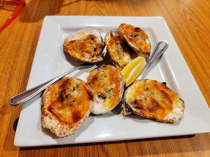 Oysters Rockefeller done right, with a golden-brown top that promises the perfect combination of richness and oceanic flavor beneath.