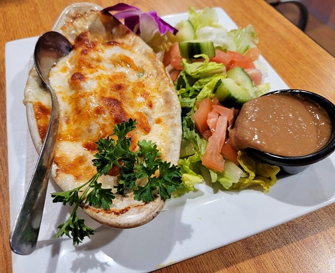 Melted cheese bubbling over fresh seafood in a bread bowl is basically a hug for your stomach.