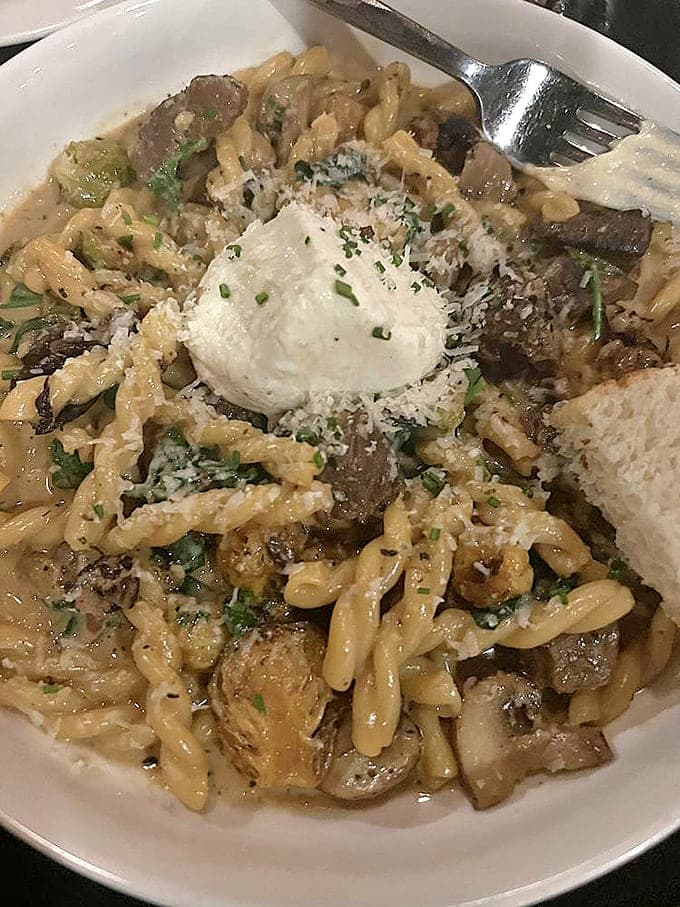 Comfort food elevated to art form, this pasta dish showcases house-made noodles and seasonal ingredients in perfect harmony.