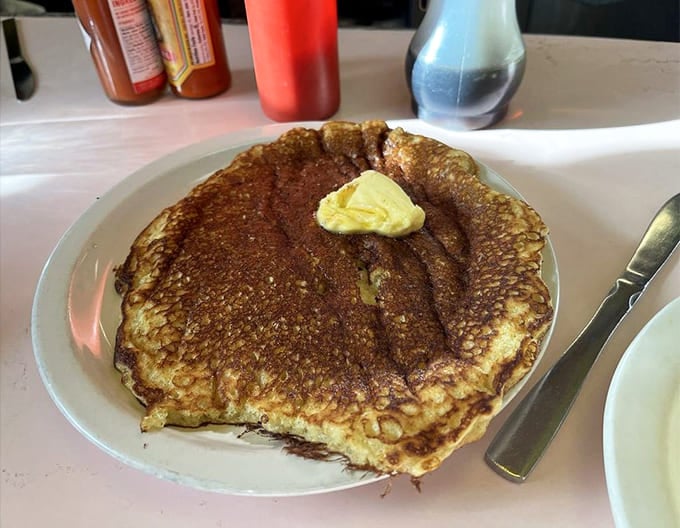 When pancakes are this size, you know you're in a real diner where portion control is considered a dirty word and butter melts into golden pools.