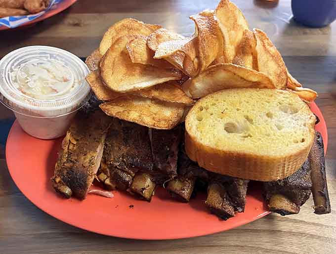 Hickory smoked ribs, toasted bread, and homemade chips create a plate that looks like summer vacation tastes.