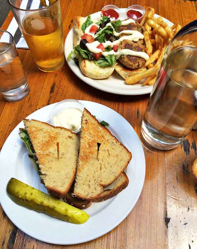 Lunchtime perfection on display &ndash; a classic sandwich served alongside golden fries, with a cold beer standing by for moral support.