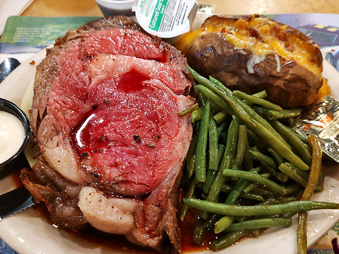 Now that's a steak fit for a king! Juicy, perfectly cooked prime rib served with a fully loaded baked potato. Diner heaven!