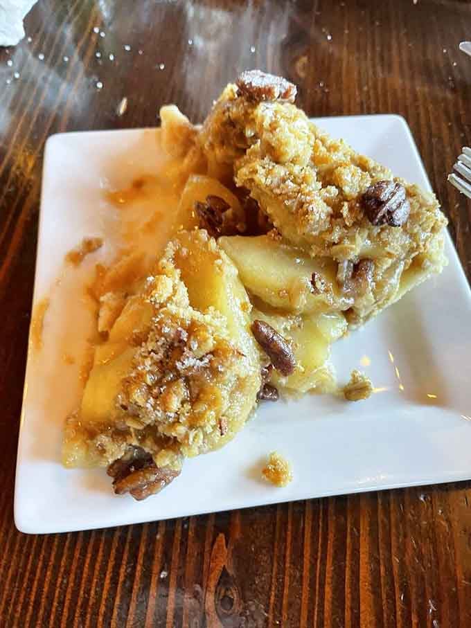 Caramel apple pecan pie captures autumn in every bite, even when there's snow on the ground outside those big windows.